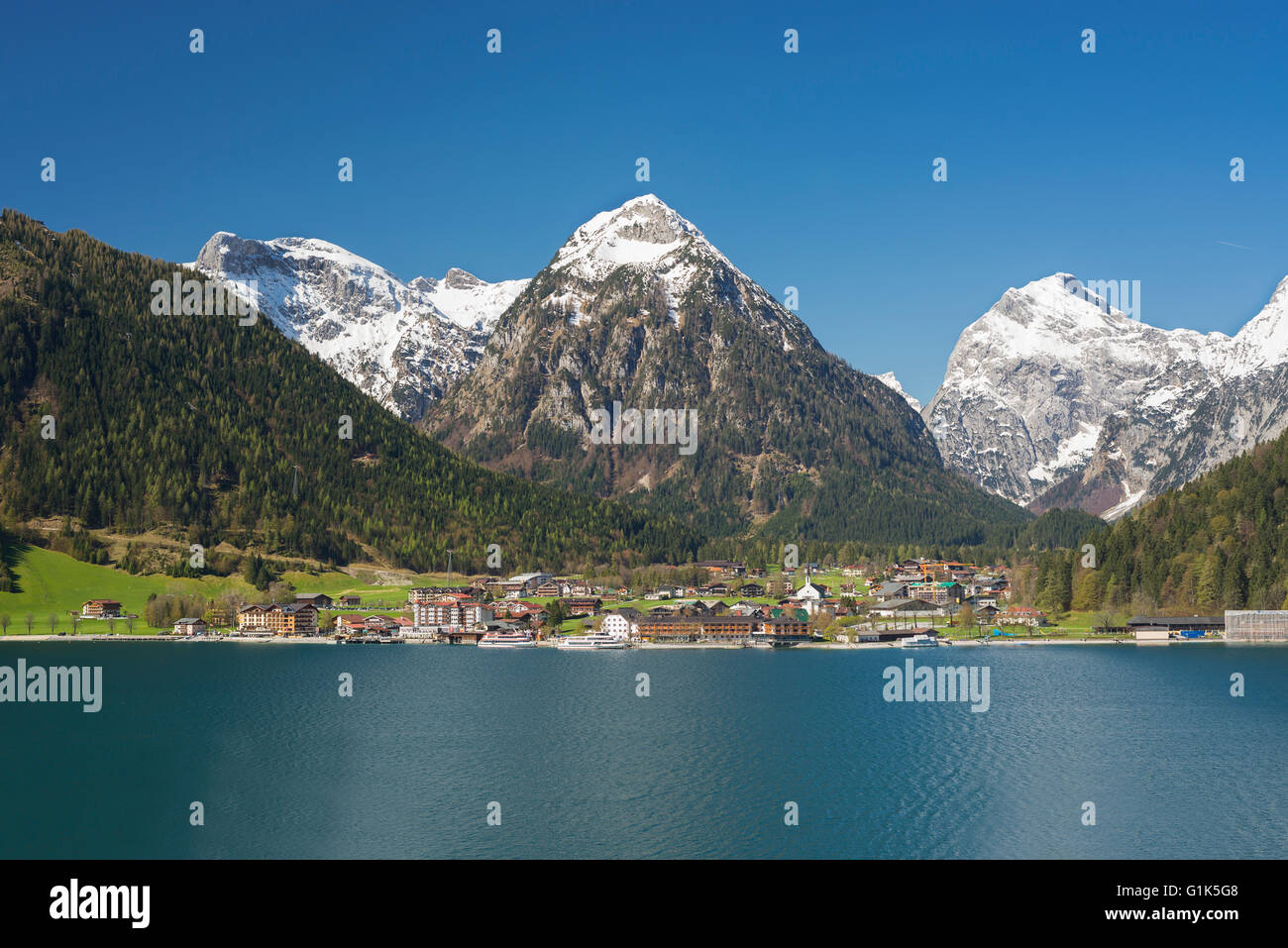 Village of Pertisau at Lake Achensee with snow-capped mountains of the ...