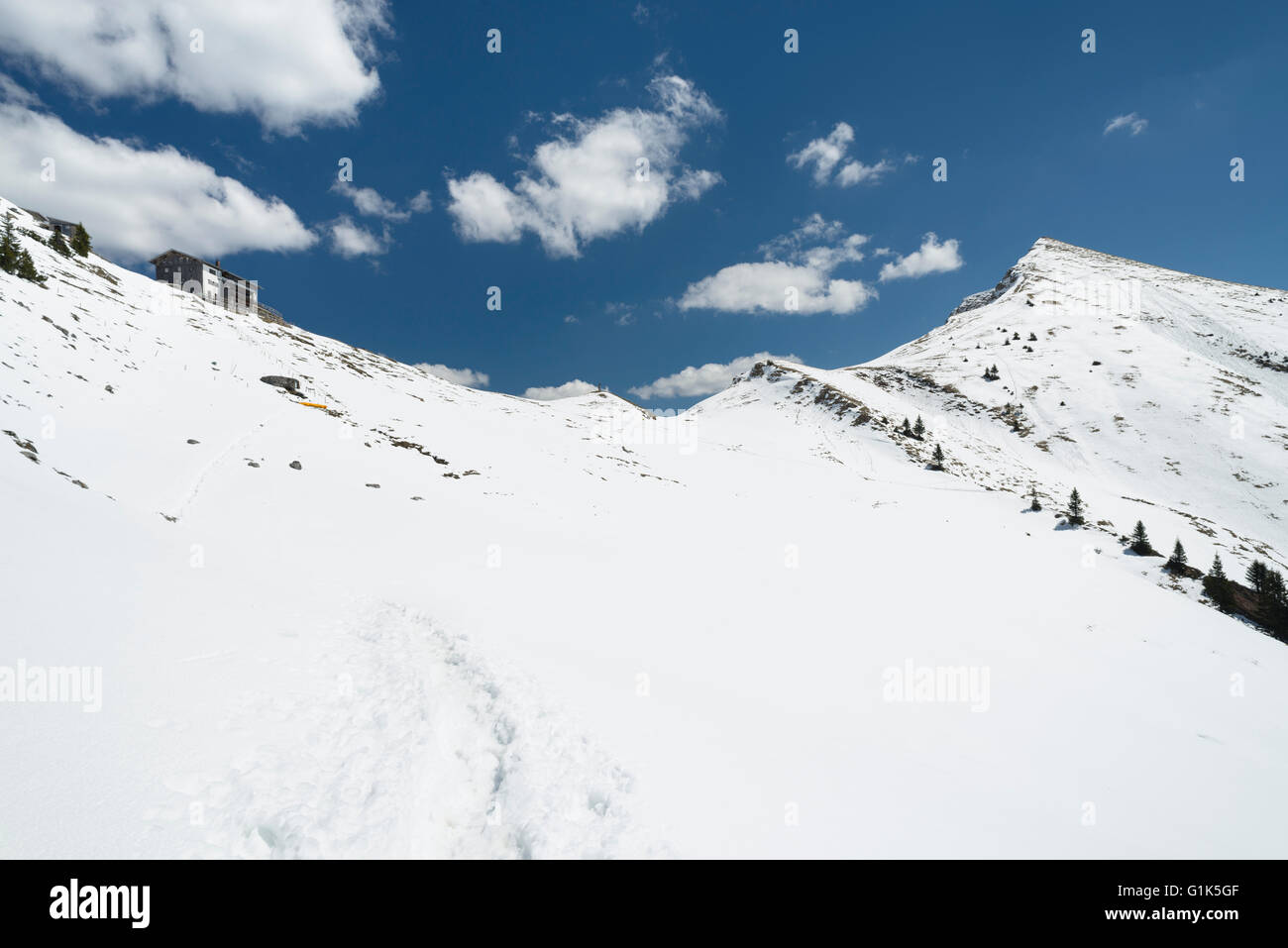 The Toelzer alpine hut at the snow-capped Delpsjoch saddle in the ...