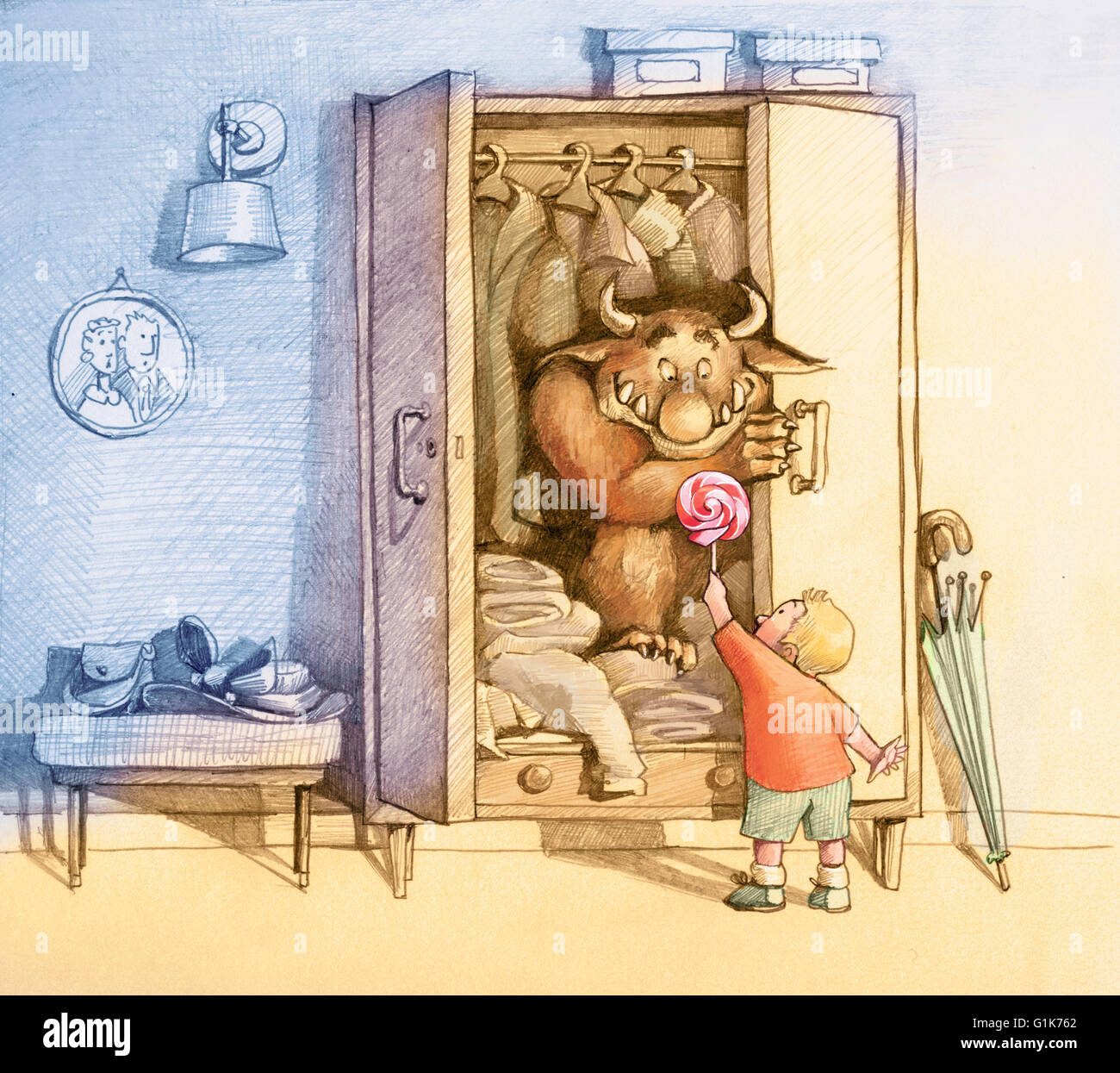 child draws a cute monster living in a closet, use a lollipop Stock ...
