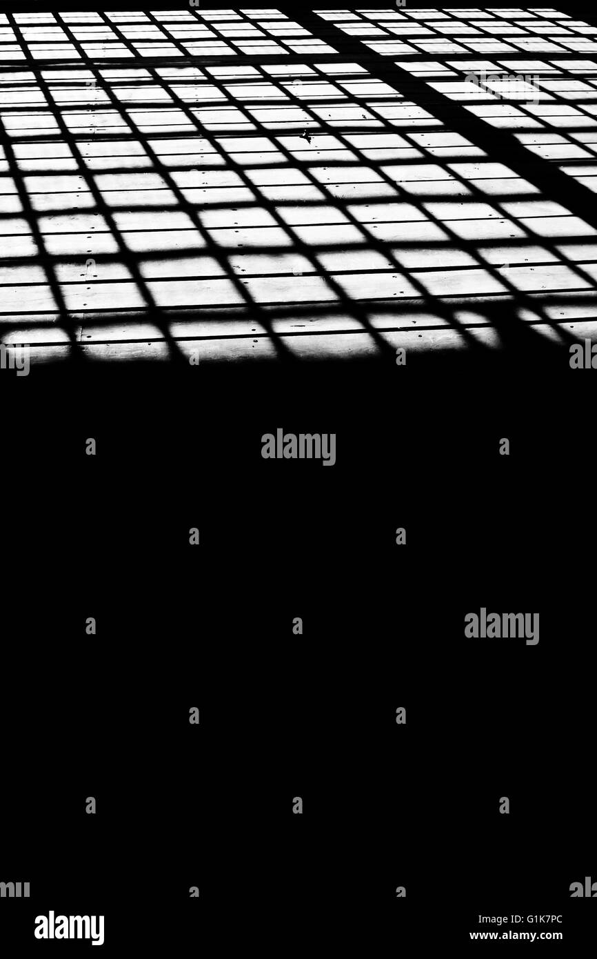 shadow of a grid on the ground Stock Photo - Alamy