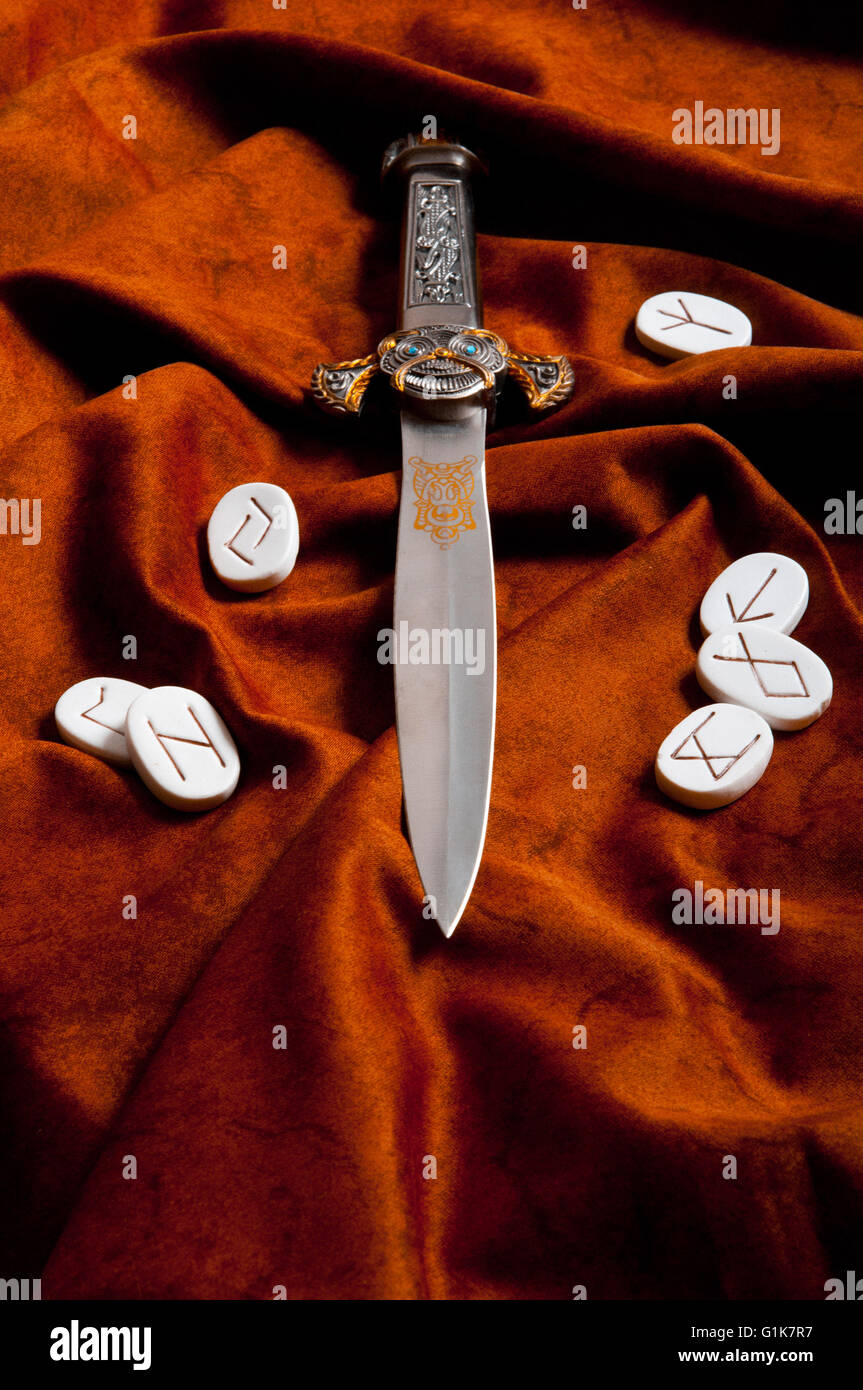 Viking sword and runes Stock Photo - Alamy