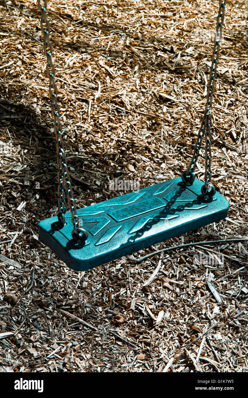 swing in a playing ground Stock Photo - Alamy
