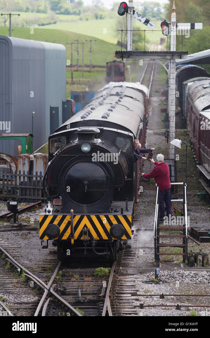 The signalman and steam train driver exchange single line tokens on the ...