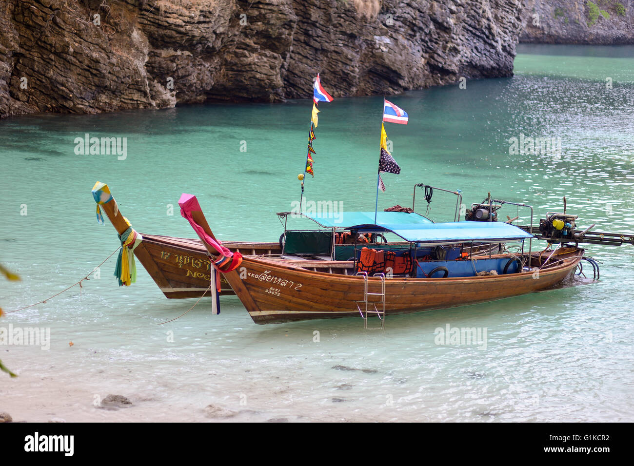 long tail boats parked at the beach Stock Photo - Alamy
