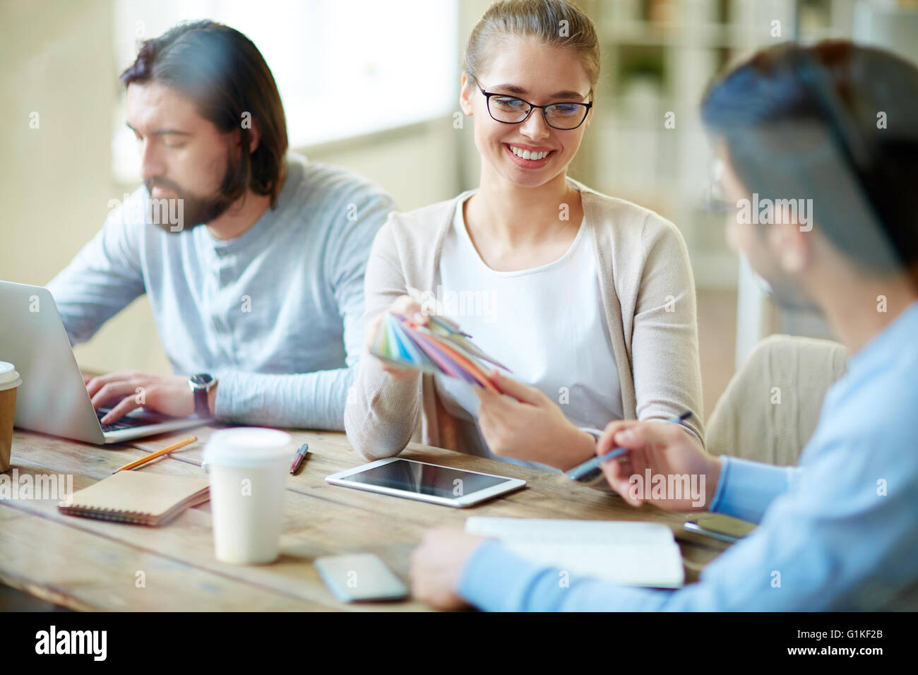 Brainstorming and discussion team working hi-res stock photography and ...