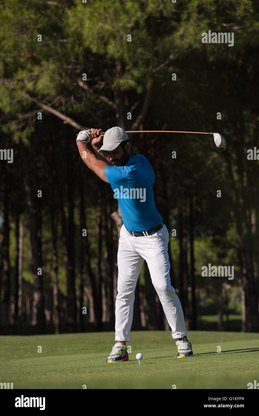 golf player hitting shot with club on course at beautiful morning Stock ...