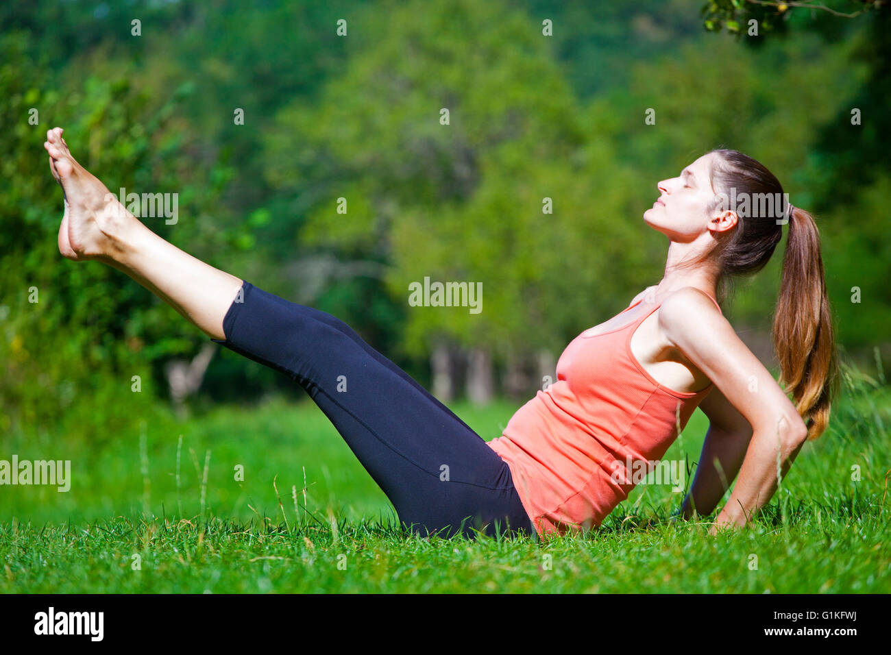 Woman practicing outside Stock Photo - Alamy