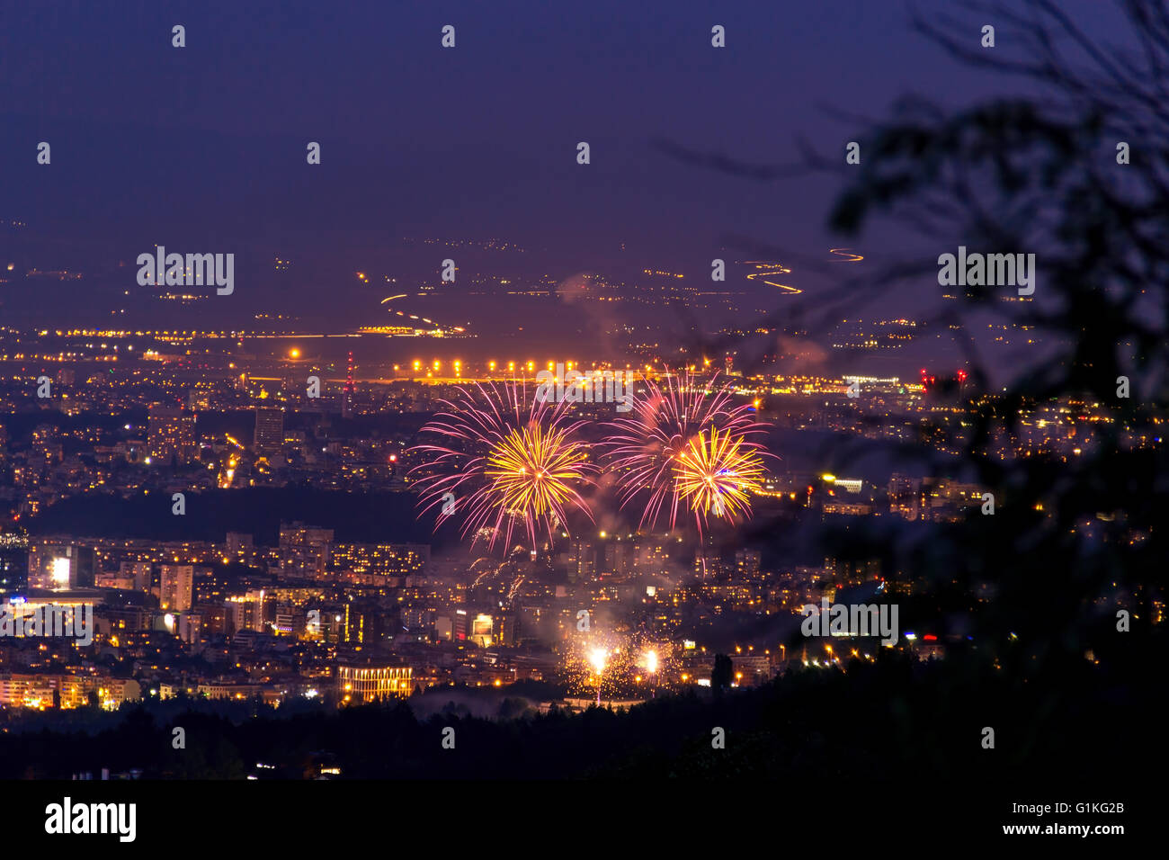 fireworks over a beautiful city at night Stock Photo - Alamy