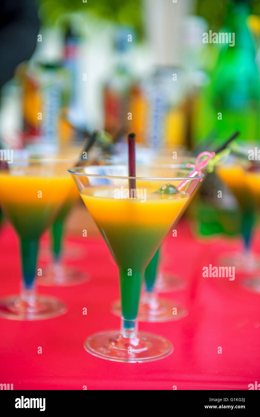 yellow green cocktail with cherry and drinking straw in summer Stock ...