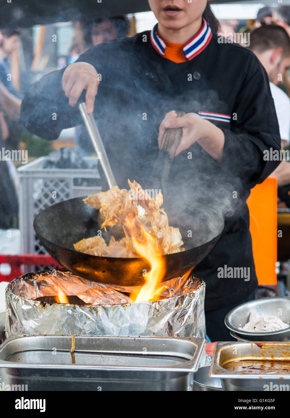 Cooking with a wok and open fire hi-res stock photography and images ...
