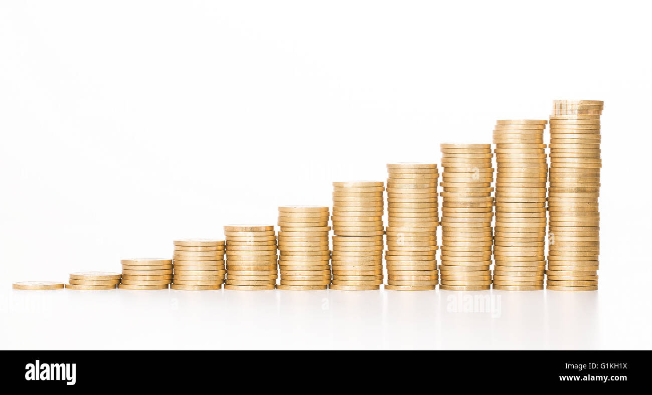 Columns of golden coins isolated on white background Stock Photo - Alamy