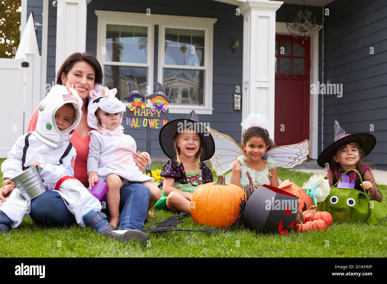 Children Dressed In Trick Or Treating Costumes On Lawn Stock Photo - Alamy