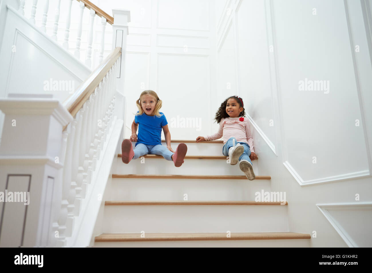 Children playing on staircase hi-res stock photography and images - Alamy