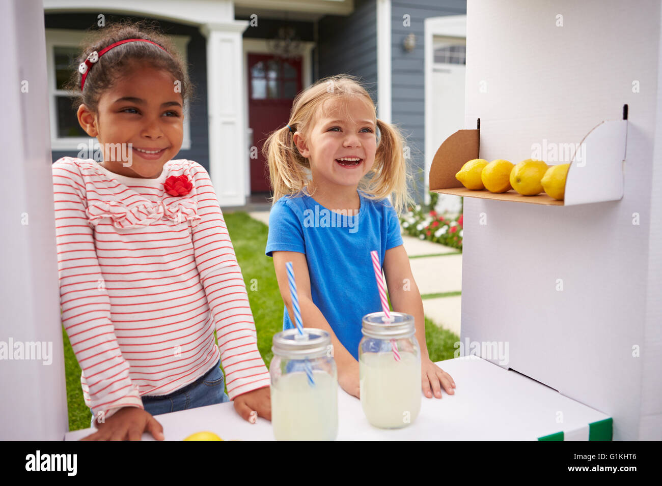 Two Girls Running Homemade Lemonade Stand Stock Photo - Alamy