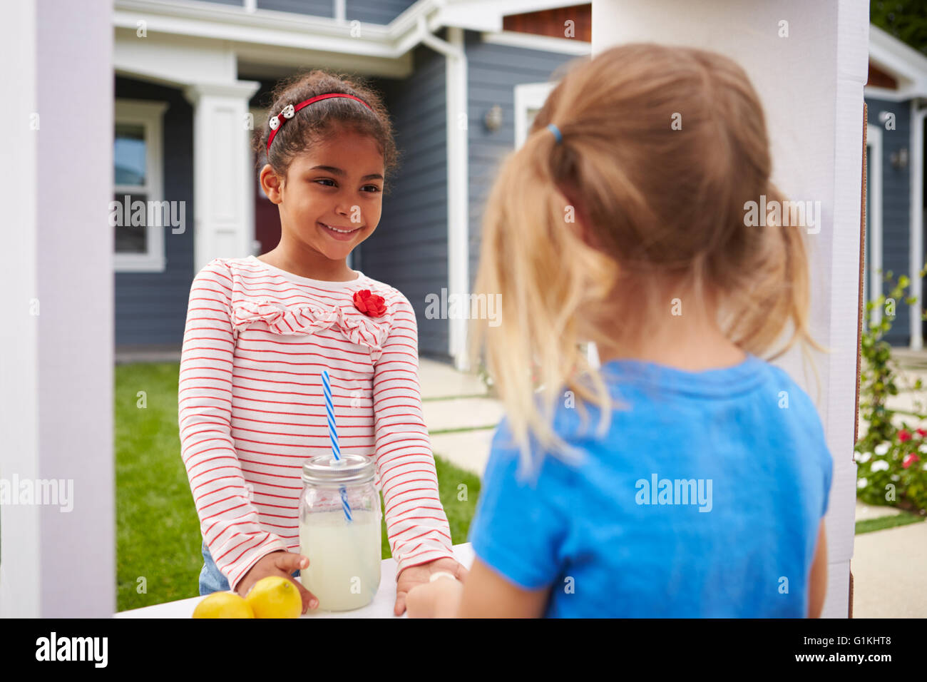 Two Girls Running Homemade Lemonade Stand Stock Photo - Alamy