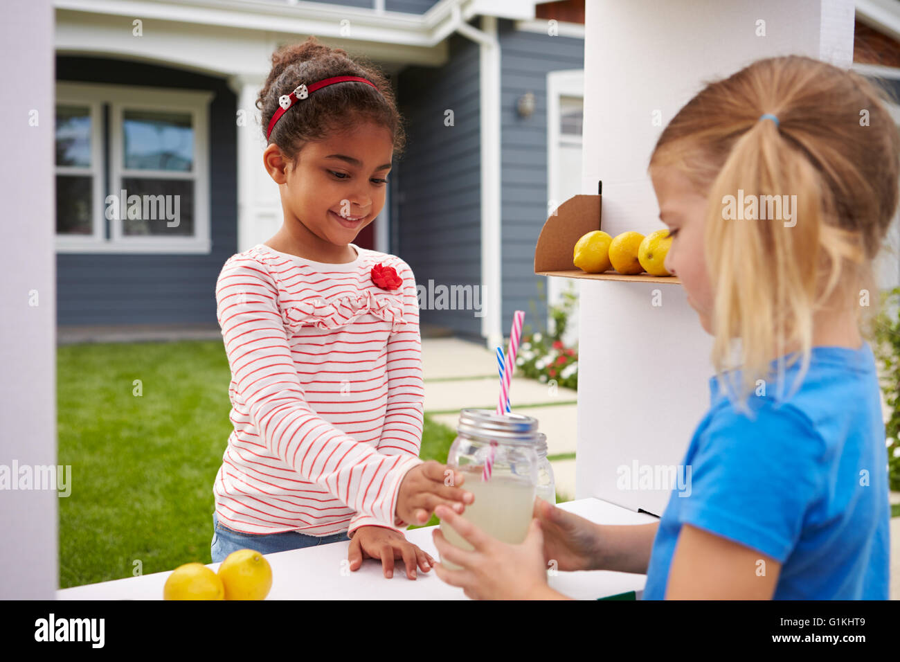 Two Girls Running Homemade Lemonade Stand Stock Photo - Alamy