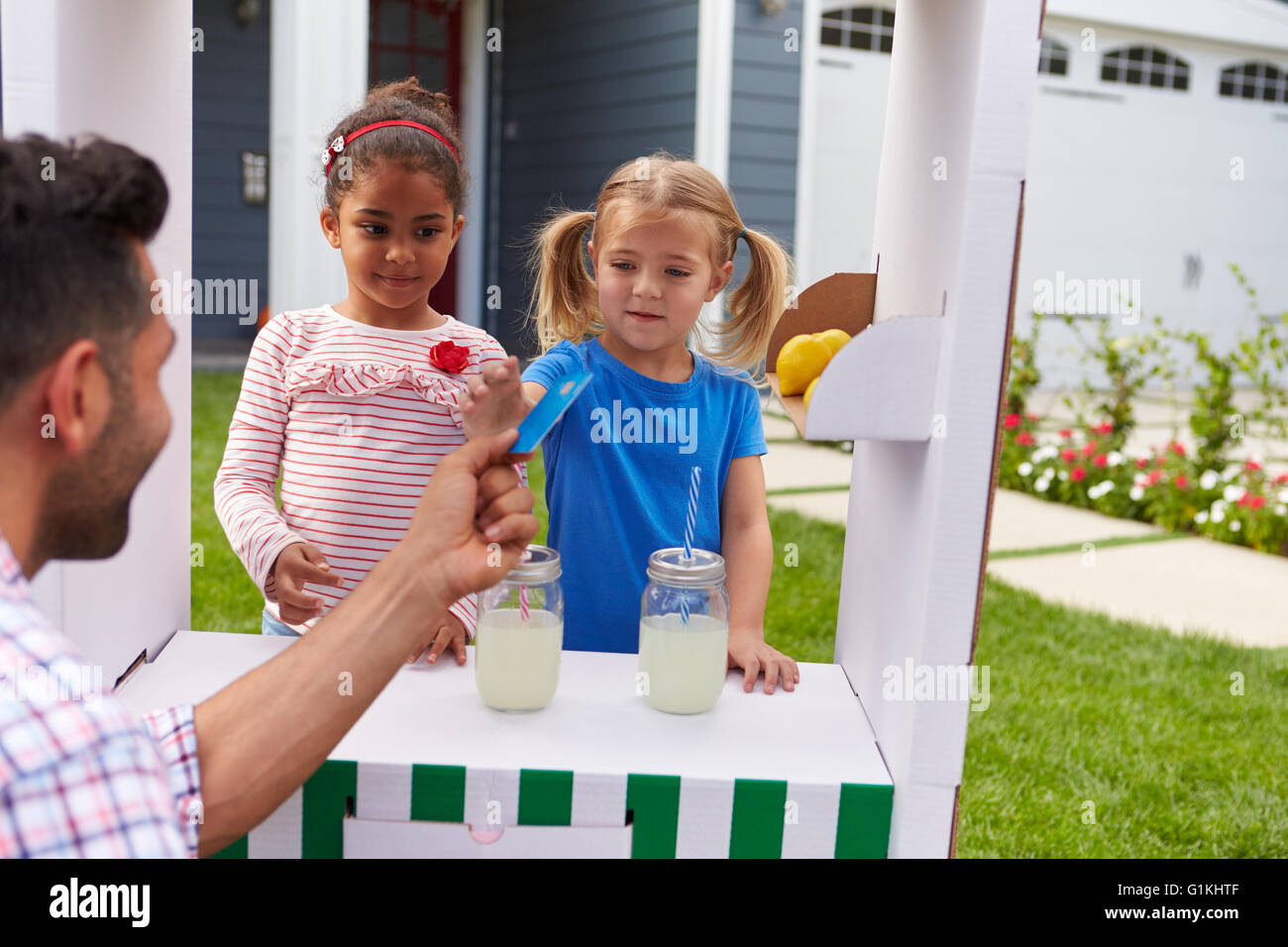 Girls Selling Homemade Lemonade From Stand At Home Stock Photo - Alamy