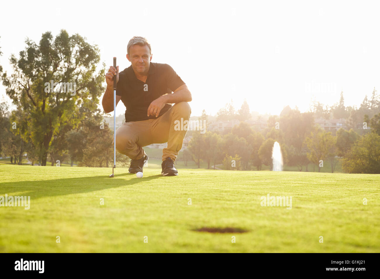 Green putting lining up putt hi-res stock photography and images - Alamy