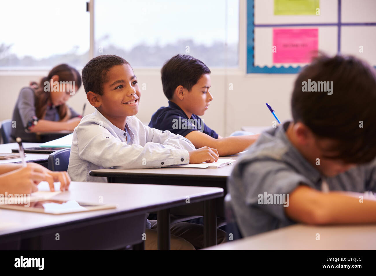 Schoolgirls in classroom students working hi-res stock photography and ...