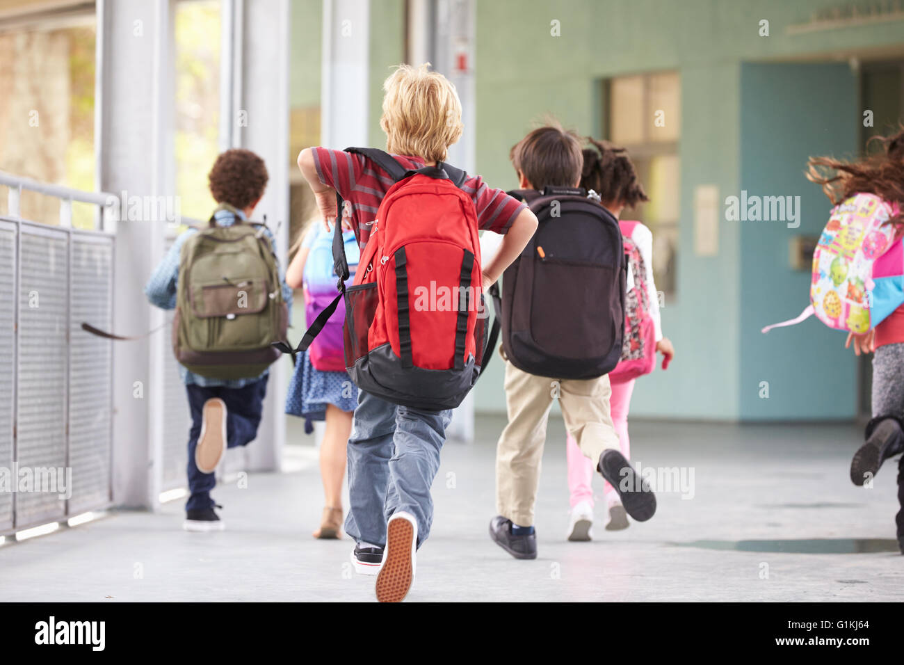 Group of elementary school kids running at school, back view Stock ...