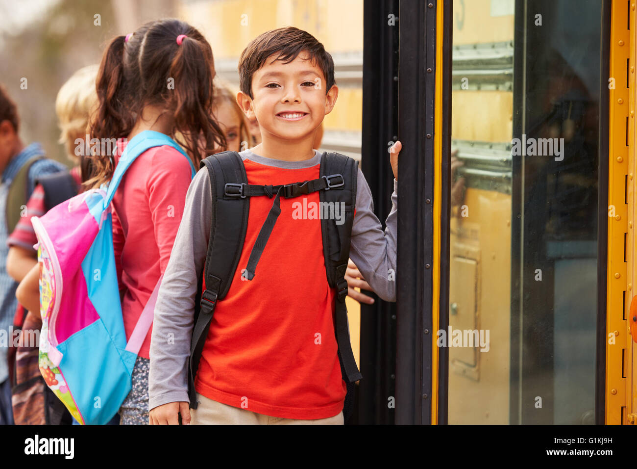Schoolboys and schoolgirls queue hi-res stock photography and images ...