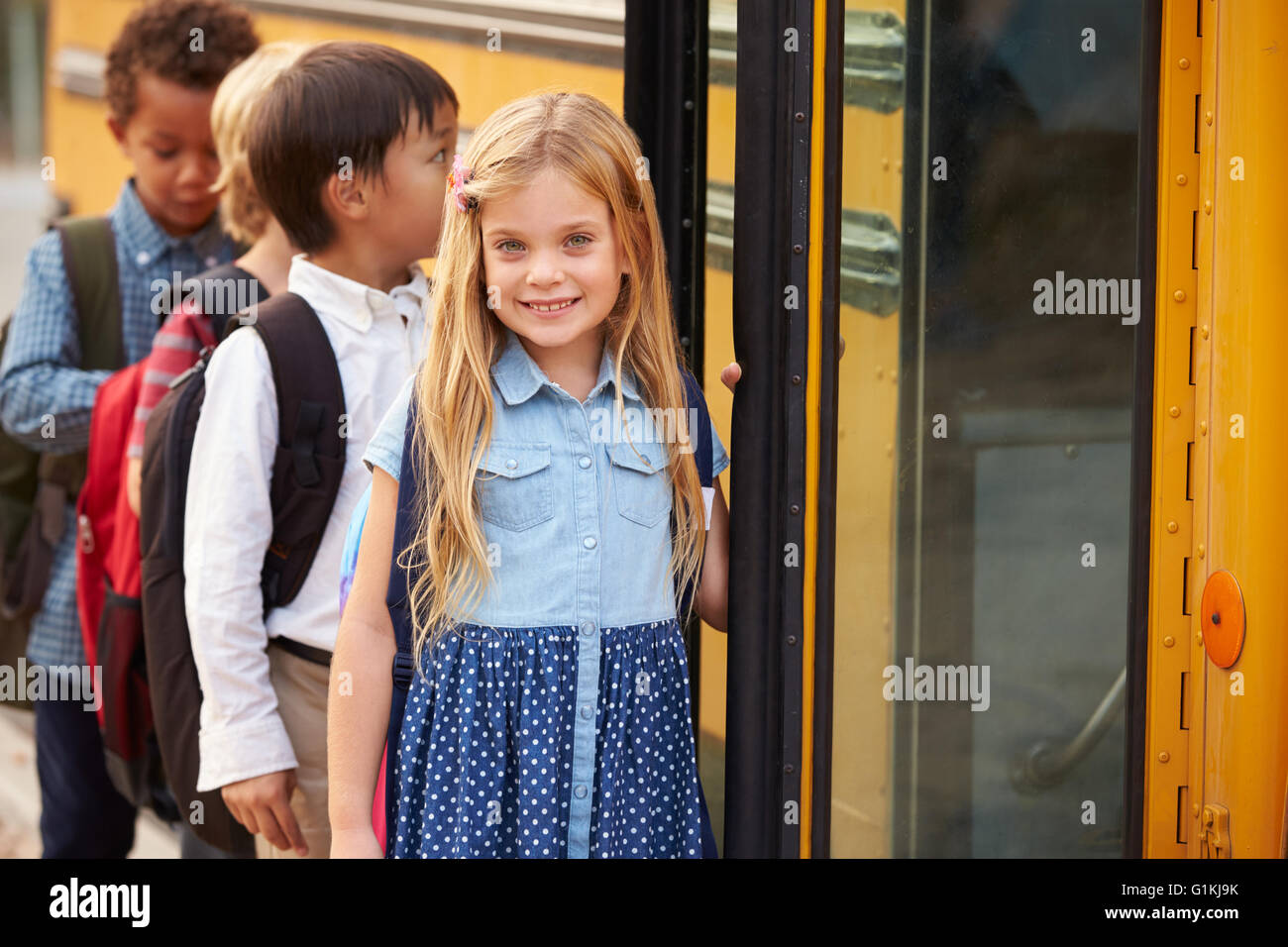 Schoolboys and schoolgirls queue hi-res stock photography and images ...