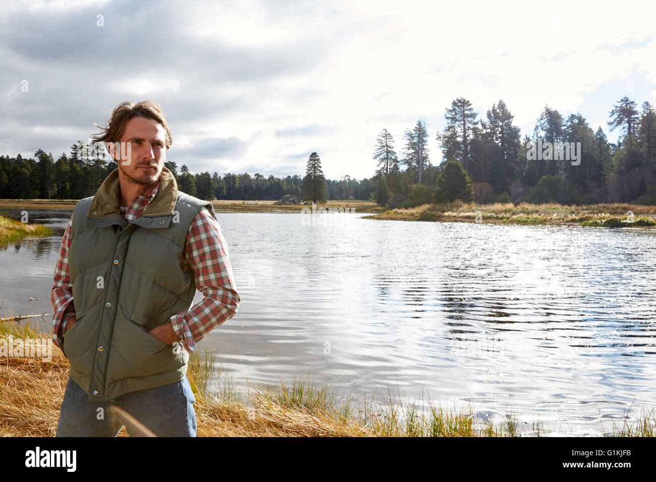 Man standing by lake, Bluff Lake, Big Bear, California, USA Stock Photo ...