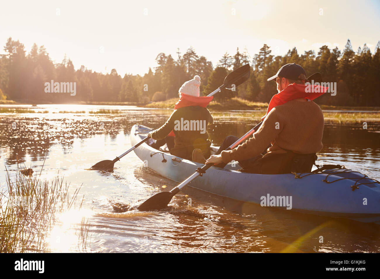Couple kayaking on lake, back view, close-up Stock Photo - Alamy