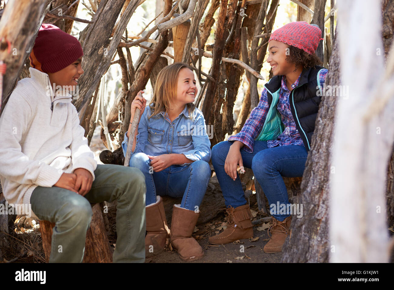 Group Of Children Playing In Forest Camp Together Stock Photo - Alamy