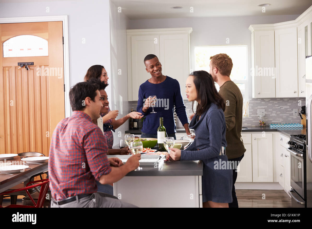 Group Of Friends Enjoying Pre Dinner Drinks At Home Stock Photo - Alamy