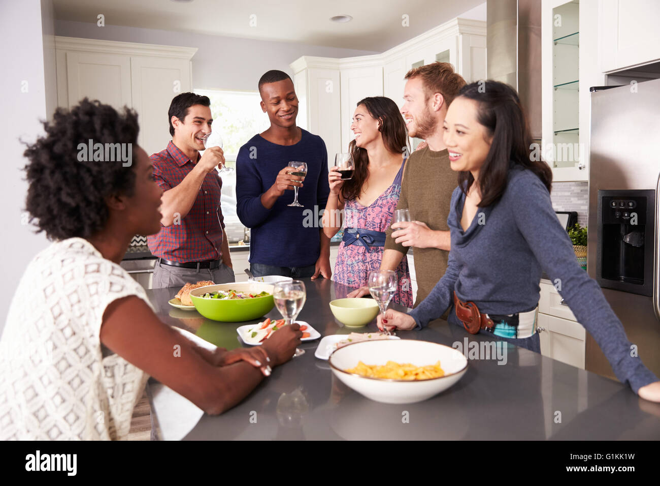 Group Of Friends Enjoying Pre Dinner Drinks At Home Stock Photo - Alamy