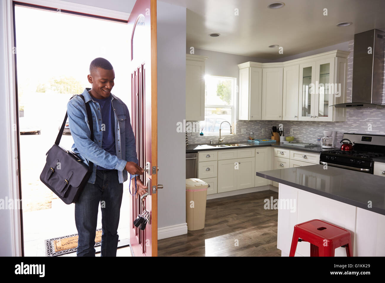 Man Coming Home From Work And Opening Door Of Apartment Stock Photo - Alamy