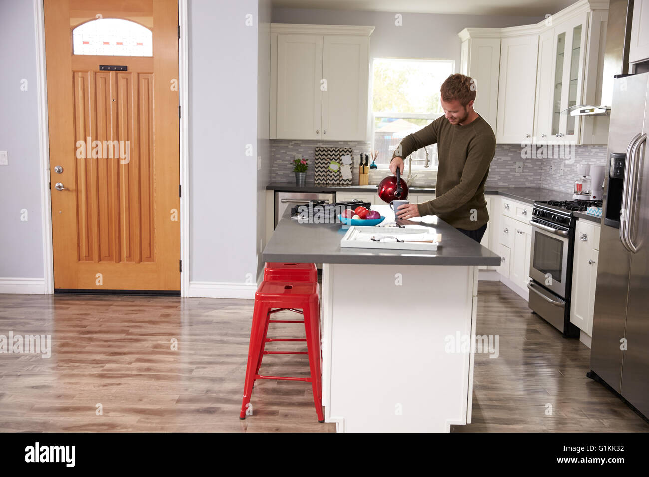 Young person coming in kitchen hi-res stock photography and images - Alamy