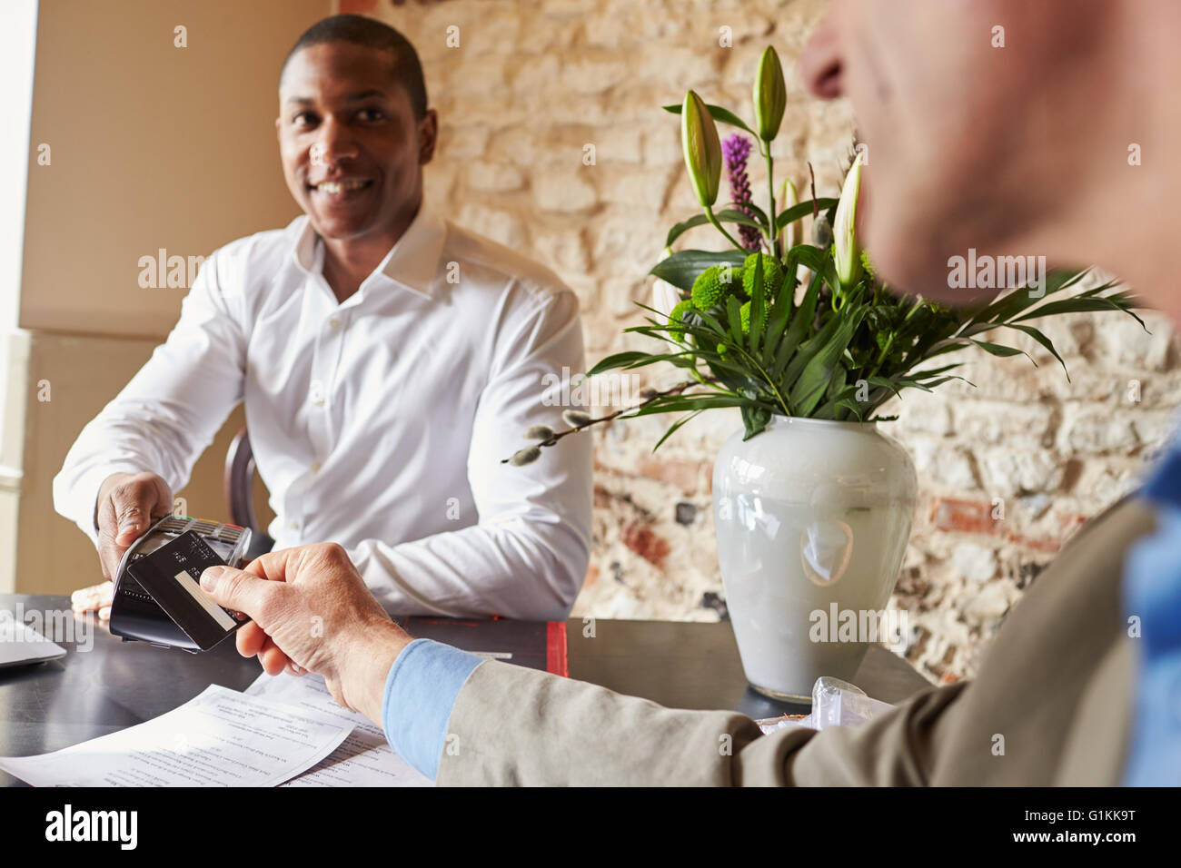 Guest making contactless card payment at hotel, close up Stock Photo ...