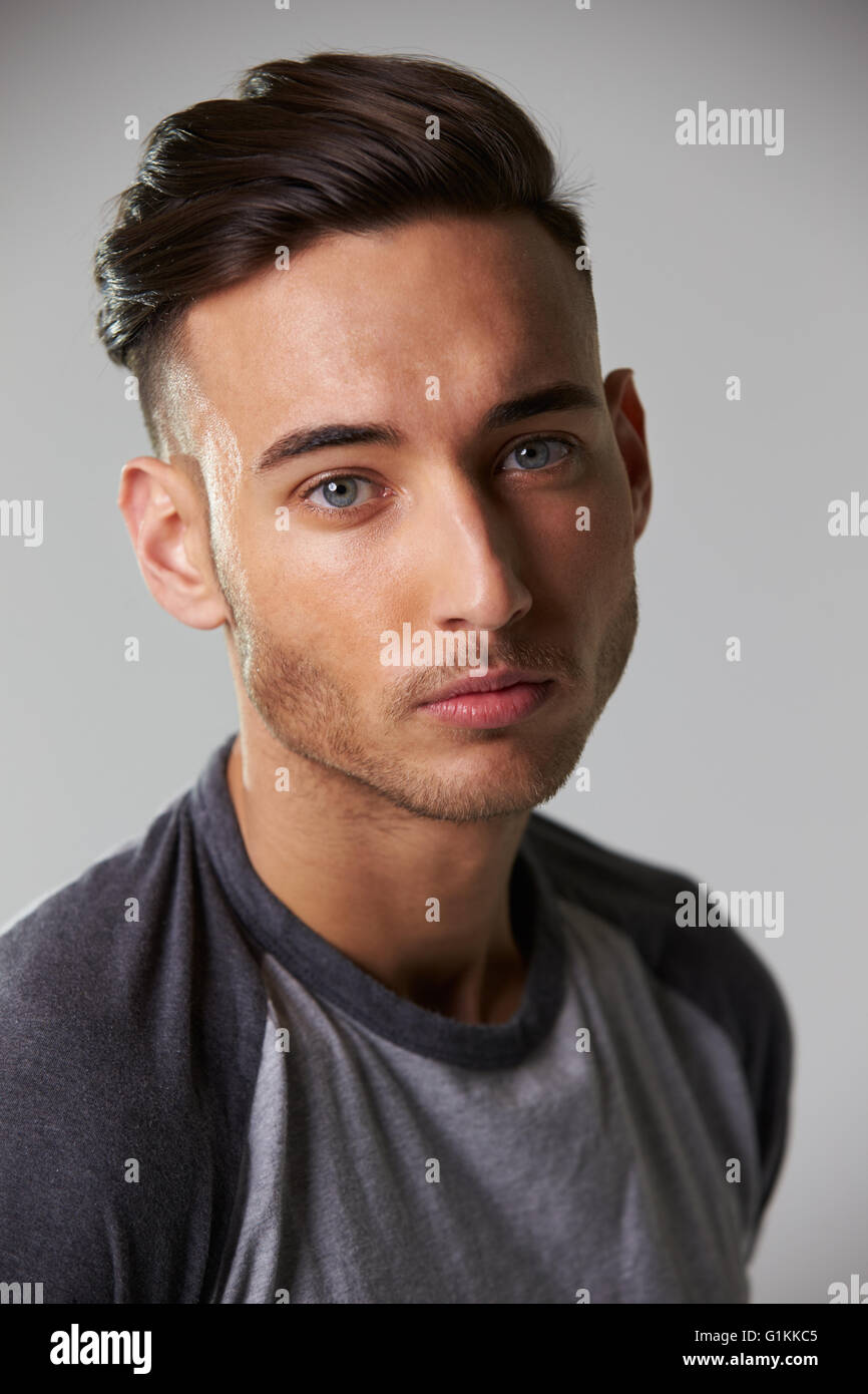 Vertical head and shoulders portrait of smiling young man Stock Photo ...