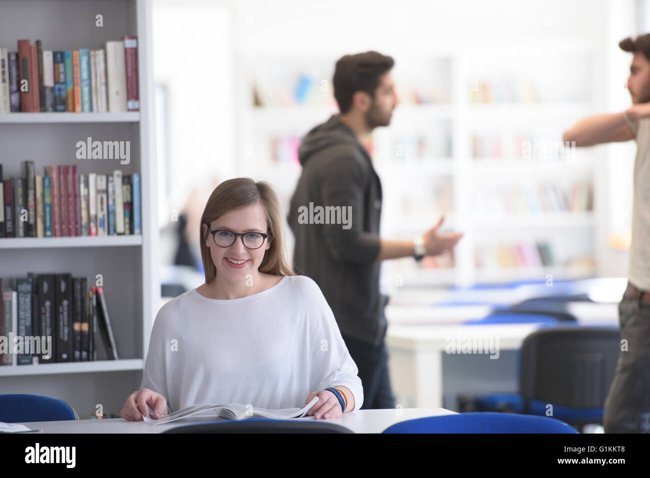 female smart looking student study in school library, group of students ...