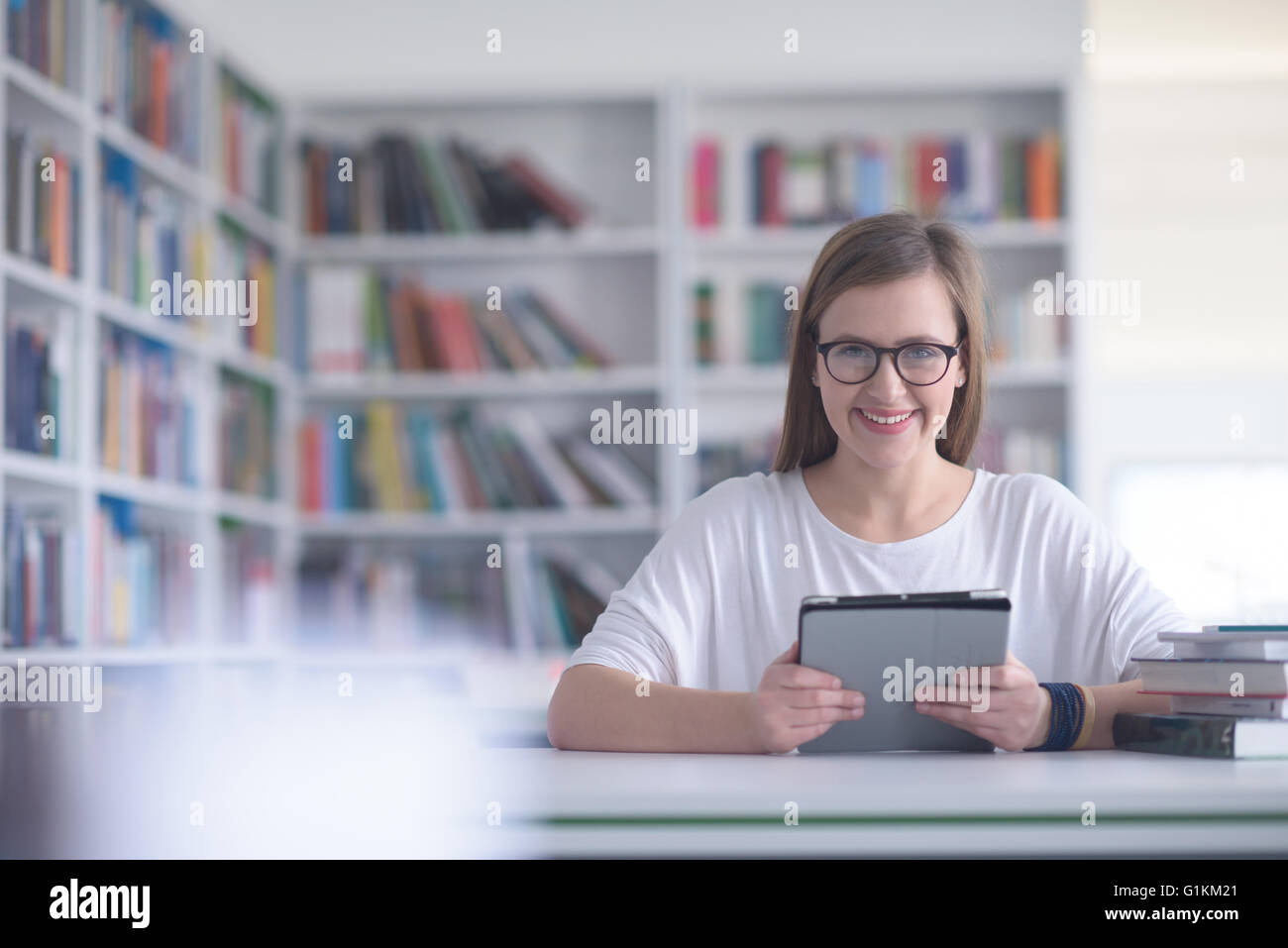 female student study in library using tablet and searching for ...