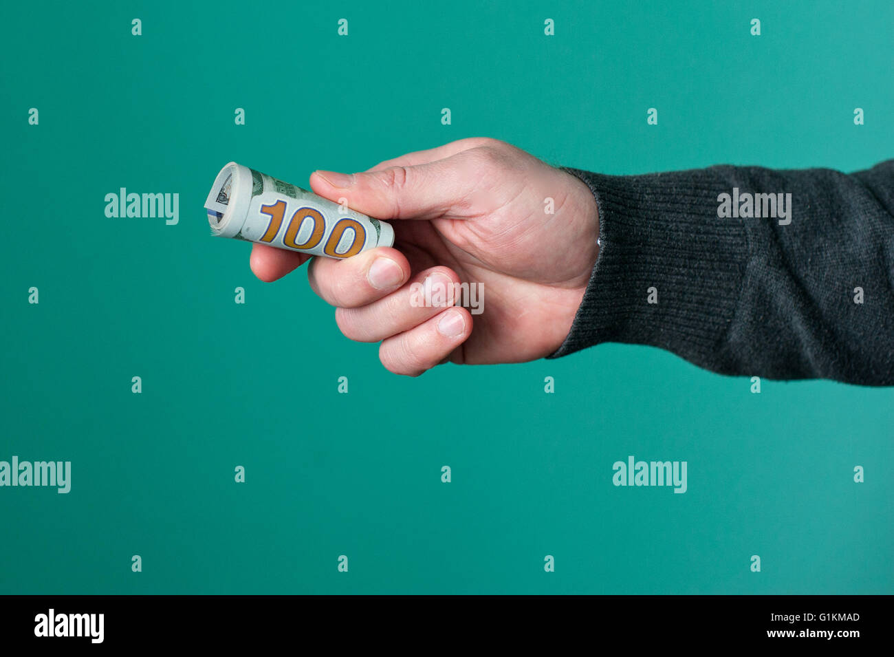 100 dollar bill rolled up hi-res stock photography and images - Alamy