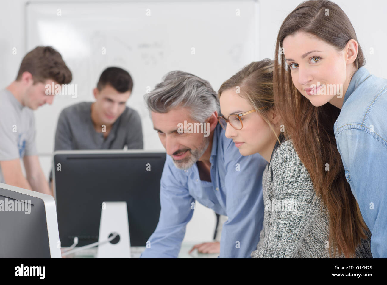 man and his computer students Stock Photo - Alamy