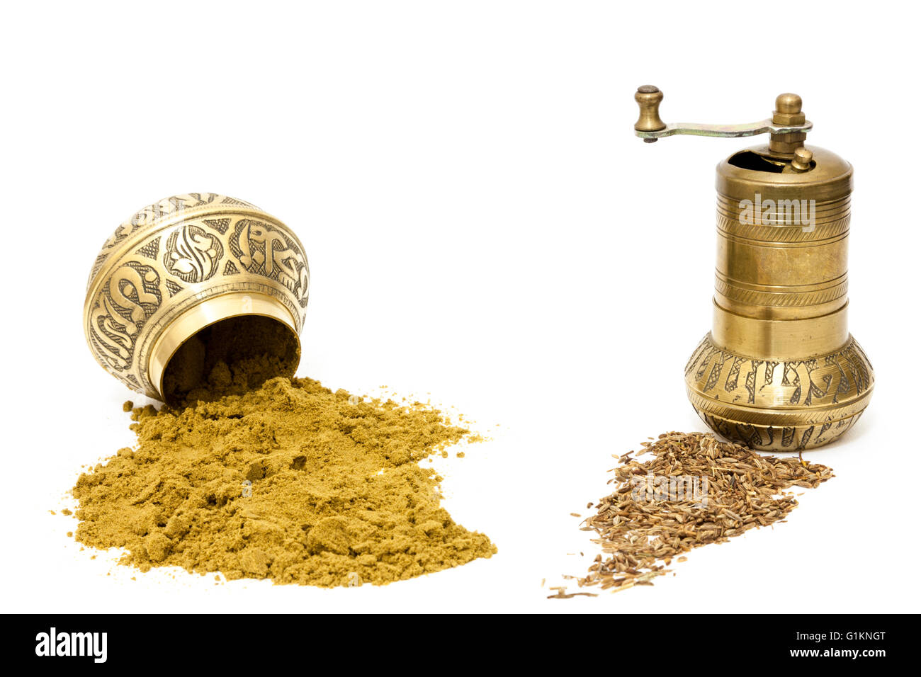 Ground cumin or jeera powder tipped from a spice bowl and whole cumin ...