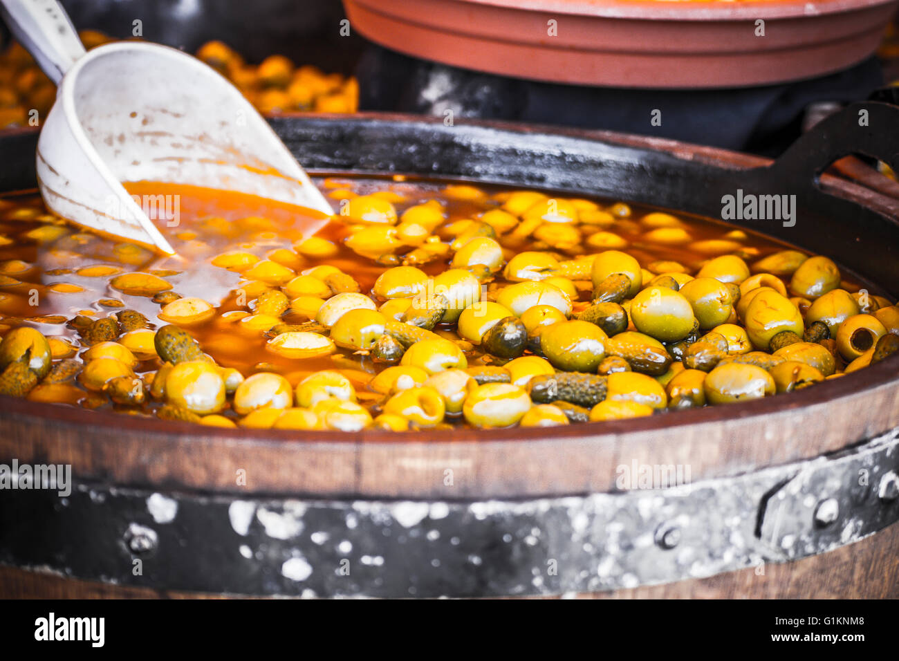 Mediterranean, Wooden drums with olives and variants Stock Photo - Alamy