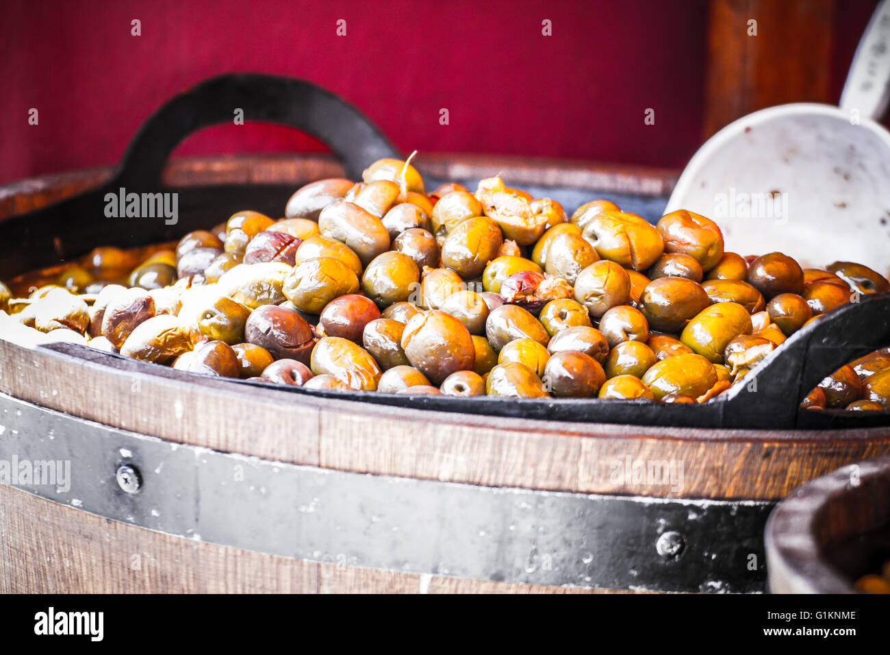 Cocktail, Wooden drums with olives and variants Stock Photo - Alamy