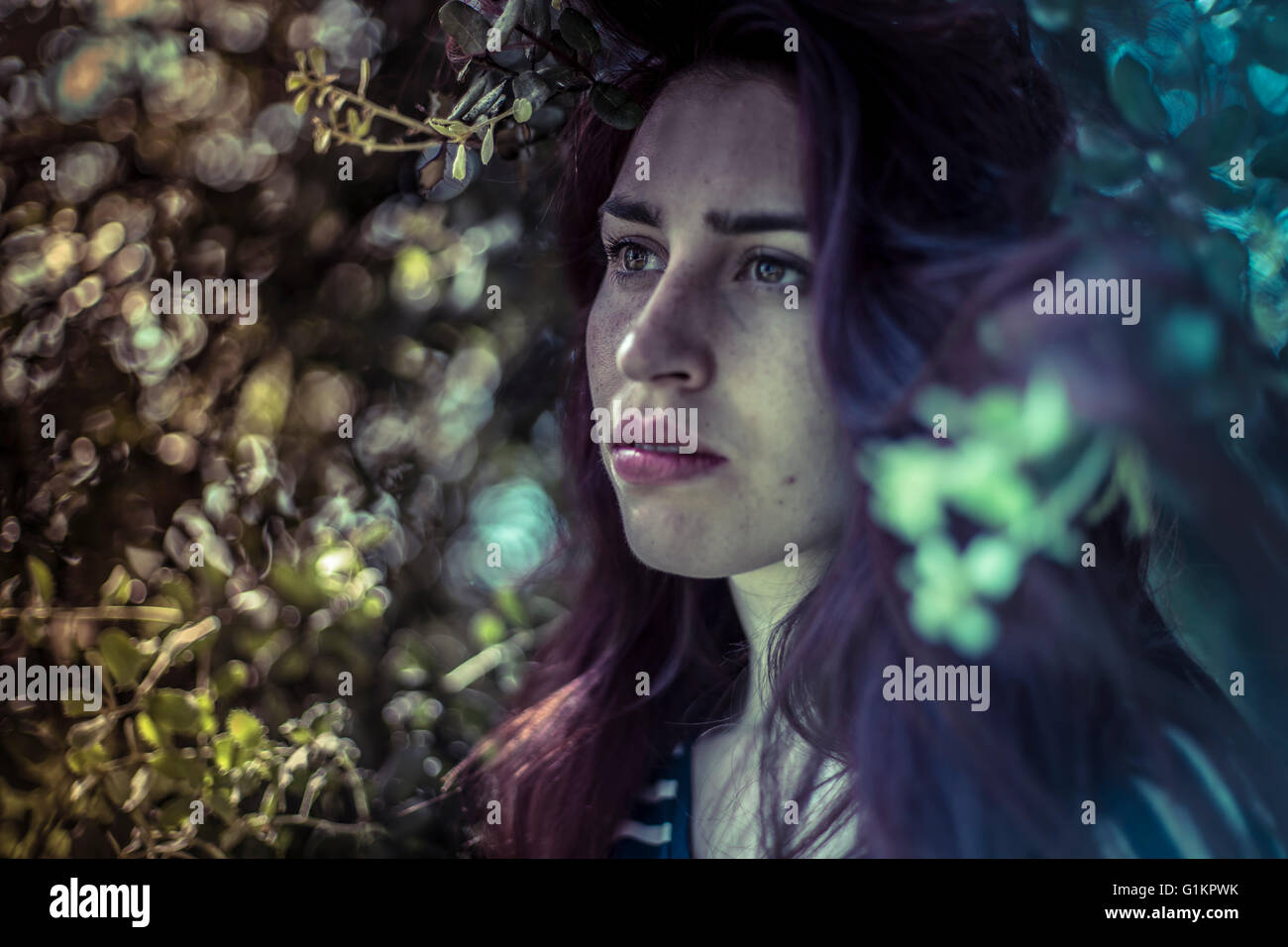 Feeling blue, melancholy young girl in a forest with sad gesture Stock ...