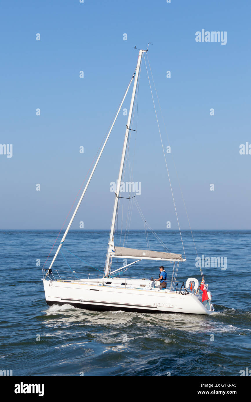 A boat setting sail for the North Sea from Whitby Harbour Stock Photo ...