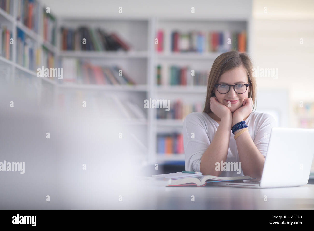 female student study in library using laptop and searching for ...