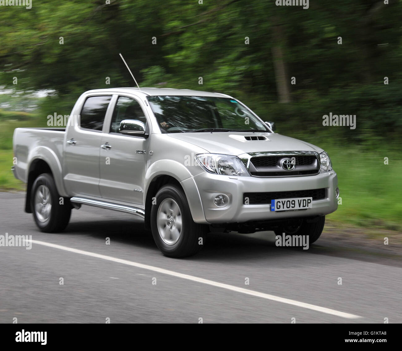 2009 Toyota Hilux pickup truck loaded with trees and plants Stock Photo ...
