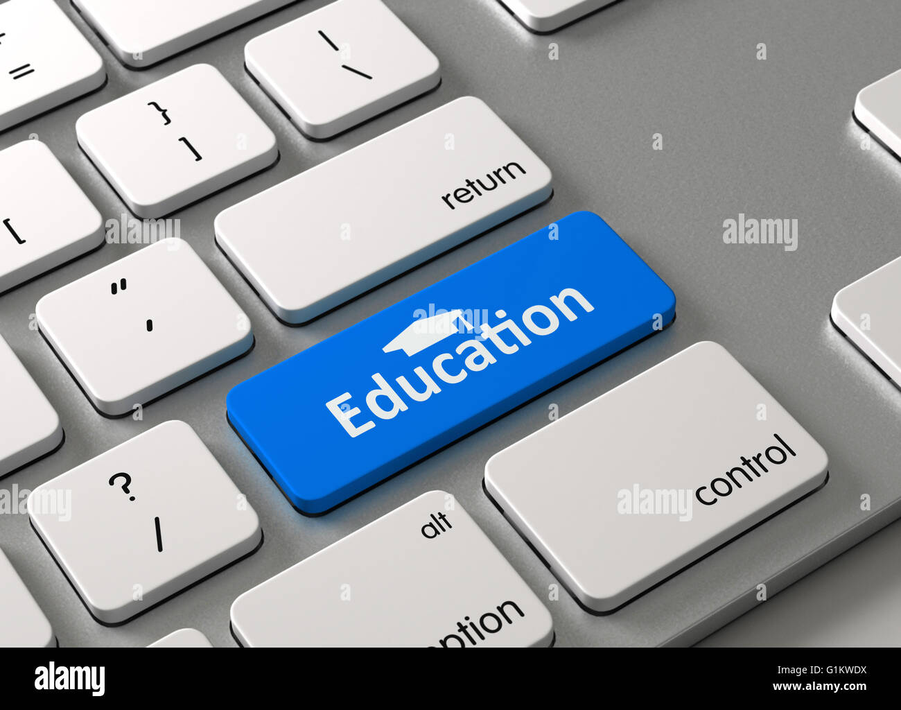 A keyboard with a blue button Education Stock Photo - Alamy