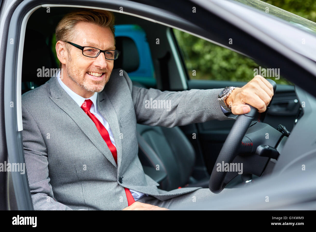 Portrait of man sat in his car Stock Photo - Alamy