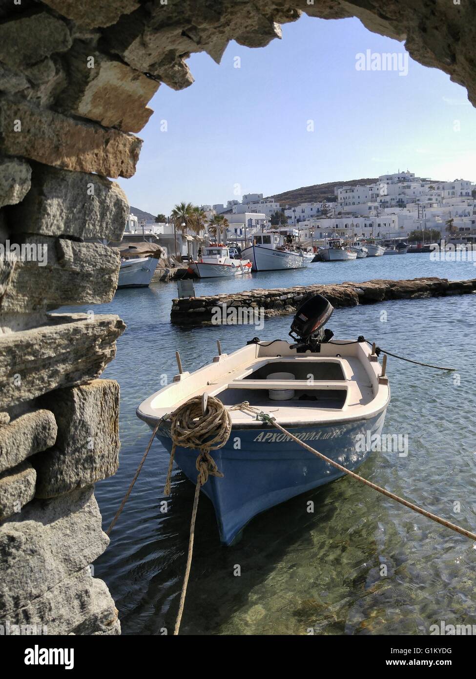 A small fishing boat at the Castle ruins in Naoussa Bay on the Island ...