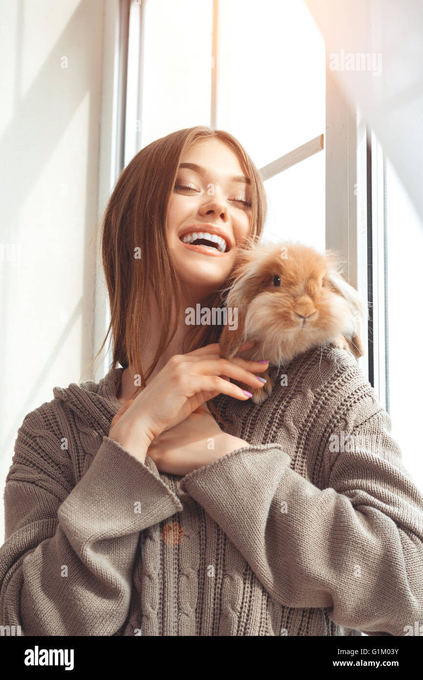 Beautiful Young Woman With Rabbit Stock Photo - Alamy